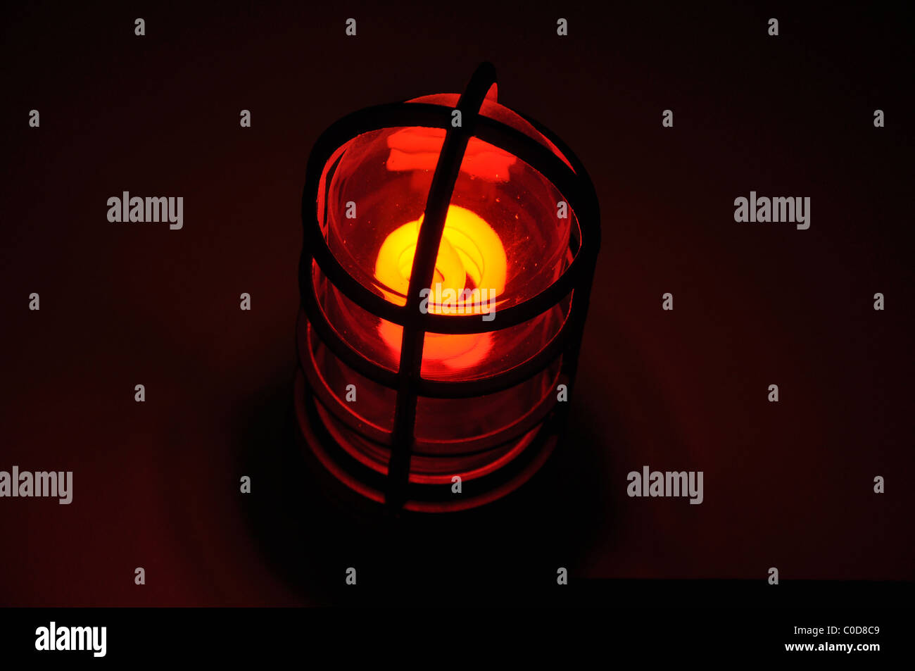 Illuminated Red light on a black background Stock Photo - Alamy