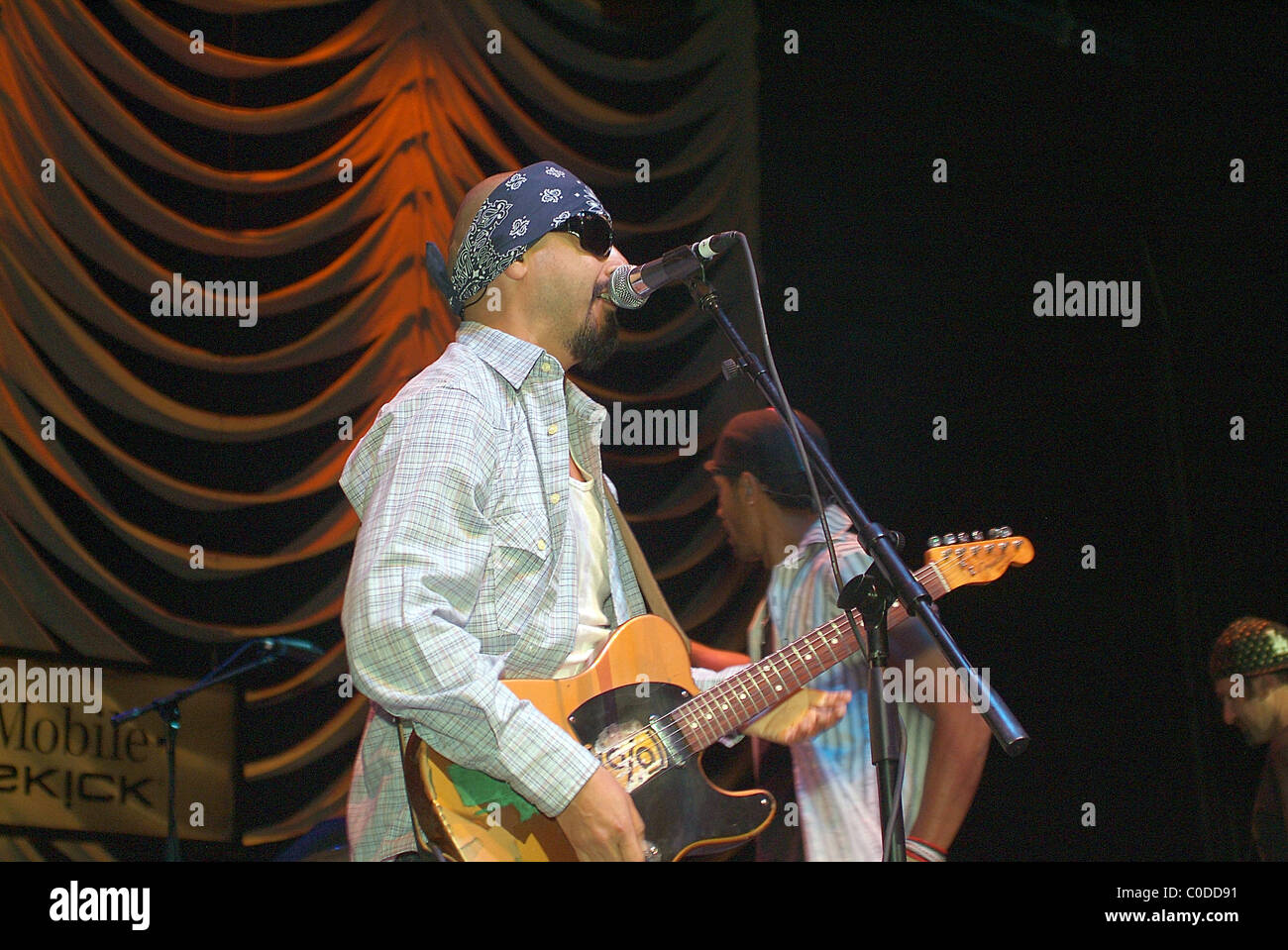 Member of Ozomatli performing at the 50th Grammy celebration concert ...