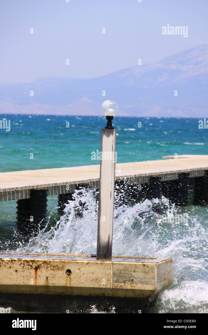 Wave breaking on pier in Turkey Stock Photo - Alamy