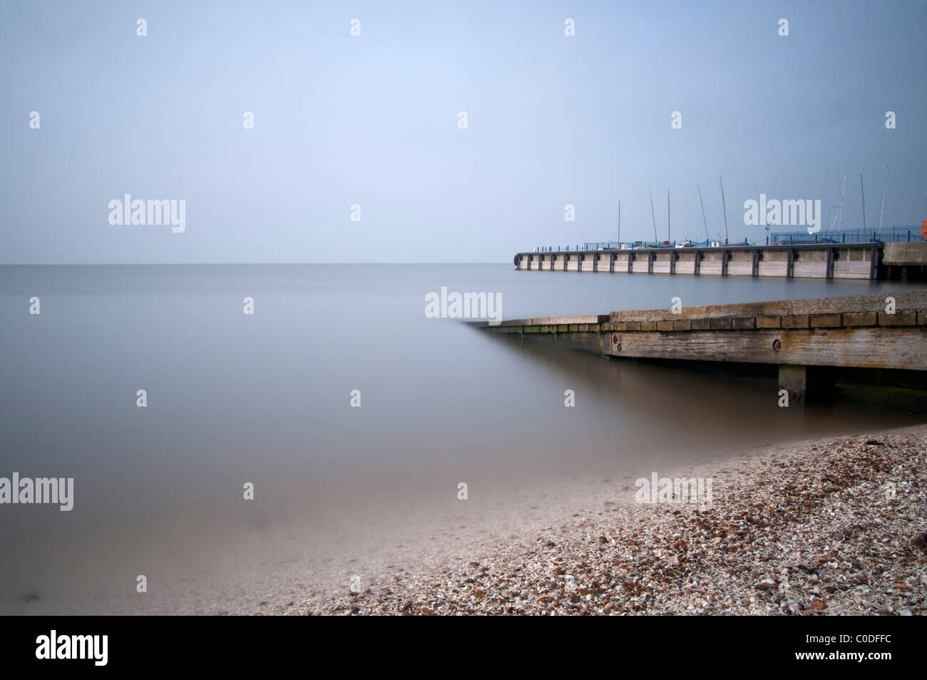 Whitstable Beach and harbour at high tide Kent England UK Stock Photo ...
