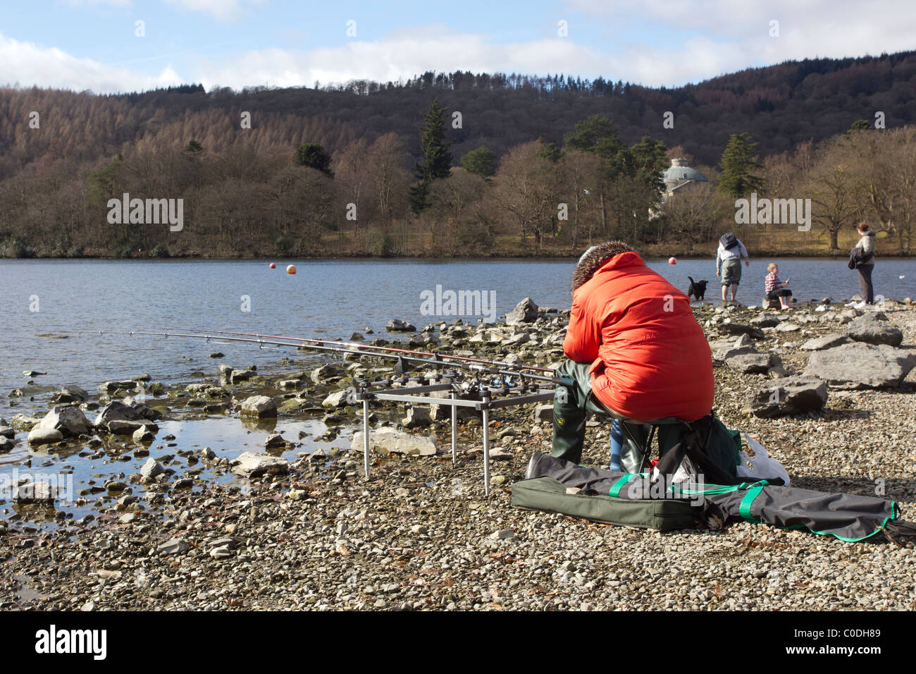 Fisherman with rod & line on Lake Windermere waiting for a catch with ...