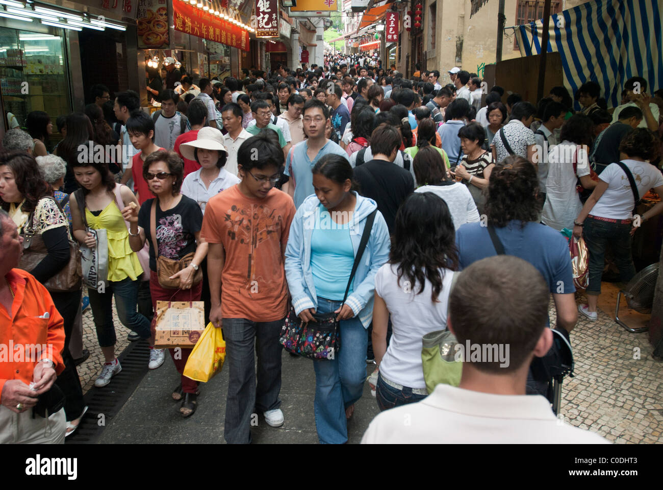 Crowds visiting Macao main street Stock Photo - Alamy