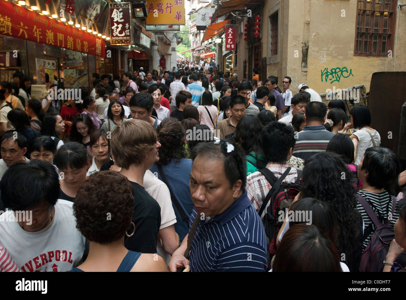 Crowds visiting Macao main street Stock Photo - Alamy