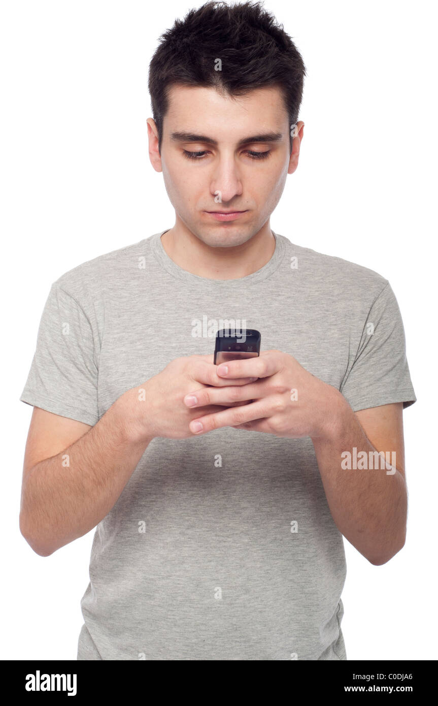young casual man sending a text message isolated on white background ...