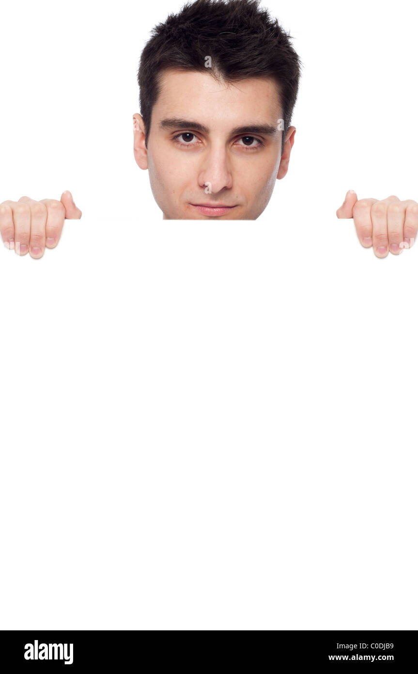 handsome young man displaying a banner ad isolated on white background ...