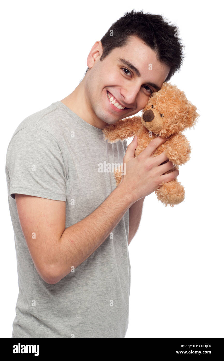 lovely portrait of a young man cuddling a teddy bear (isolated on white ...