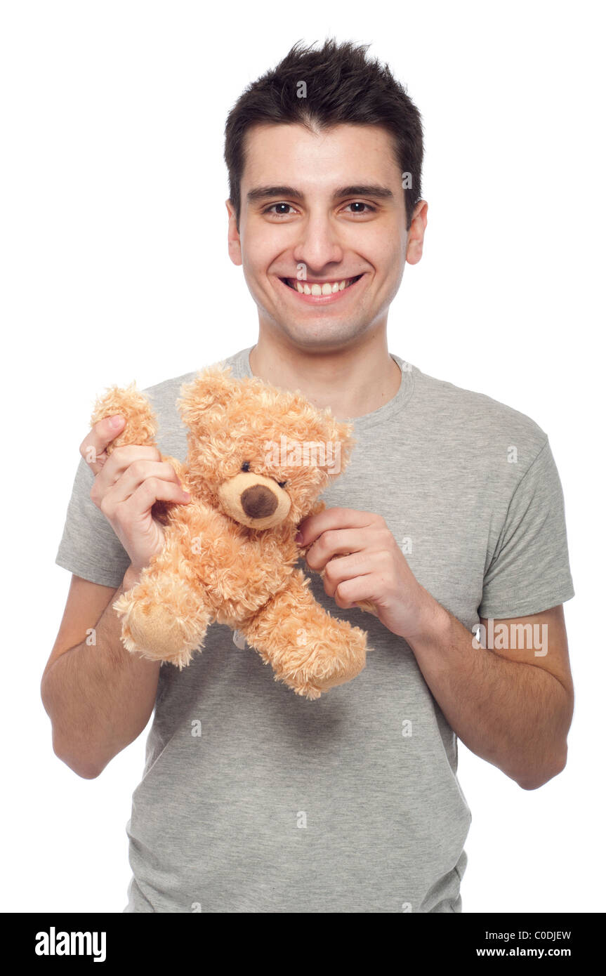lovely portrait of a young man cuddling a teddy bear (isolated on white ...
