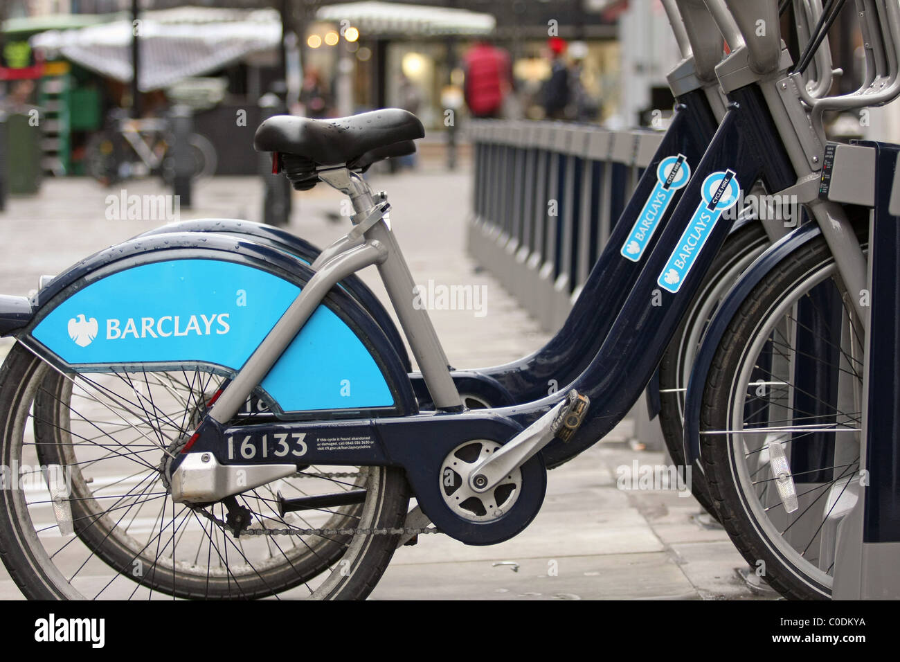 Two bikes in an almost empty rack of cycles in The London Cycle Hire ...