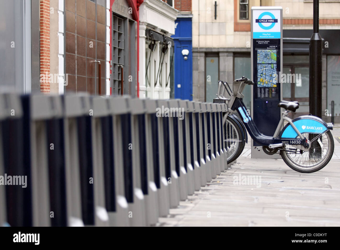 Two bikes in an almost empty rack of cycles in The London Cycle Hire ...