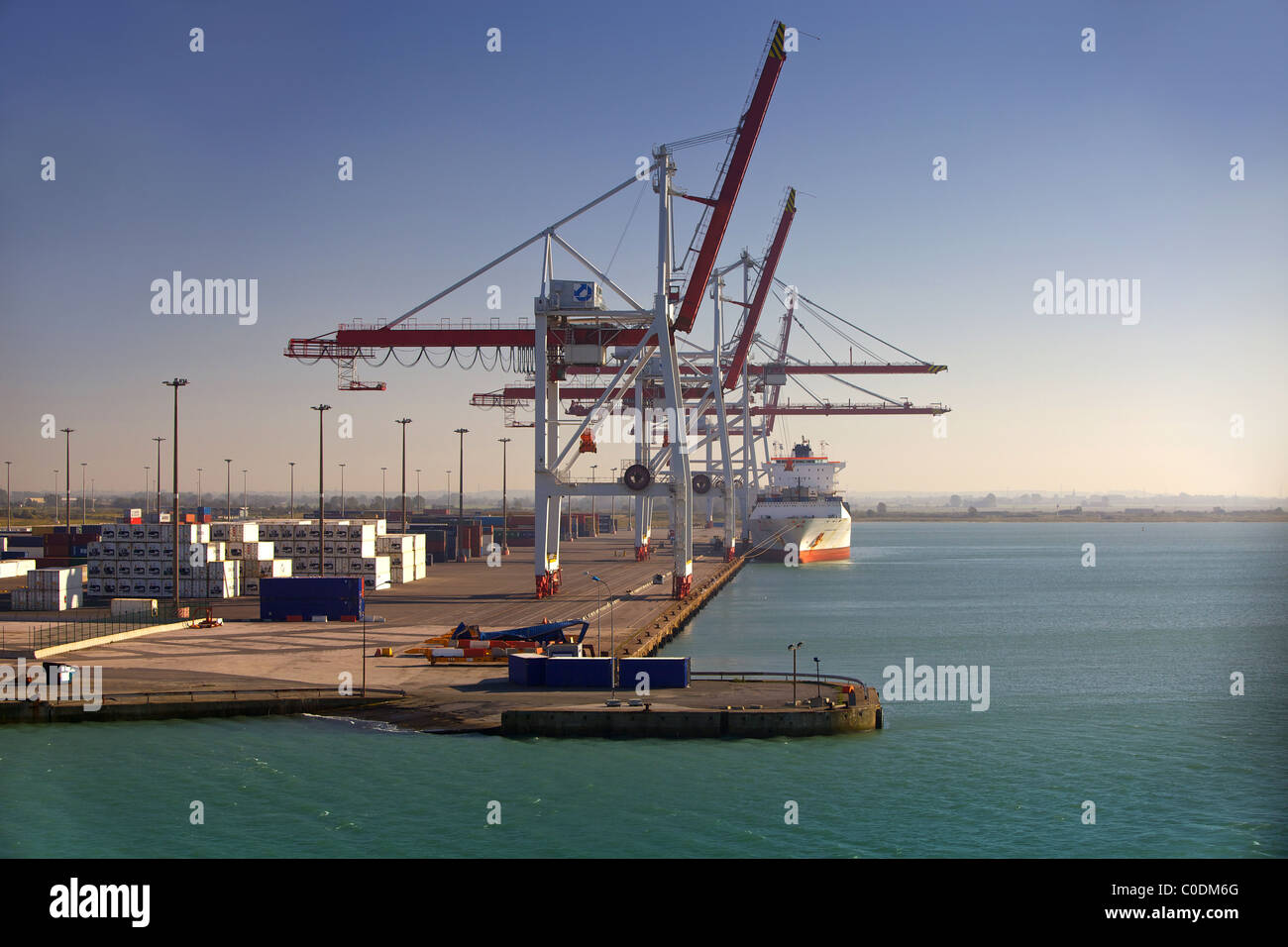 Container ship being unloaded at port Stock Photo - Alamy