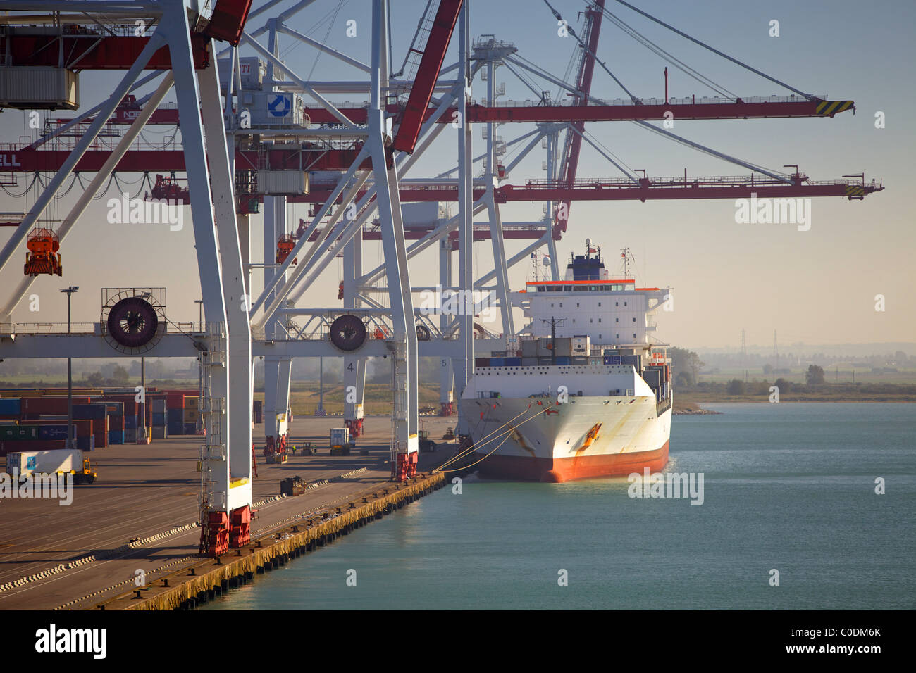 A container ship moored and ready for unloading at a container terminal ...