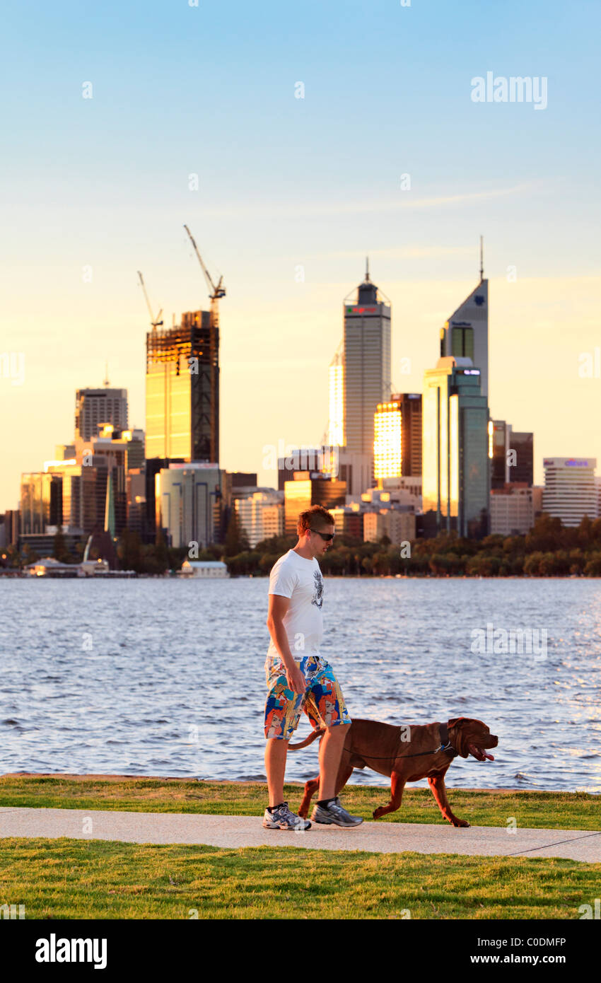 Man walking dog down path hi-res stock photography and images - Alamy