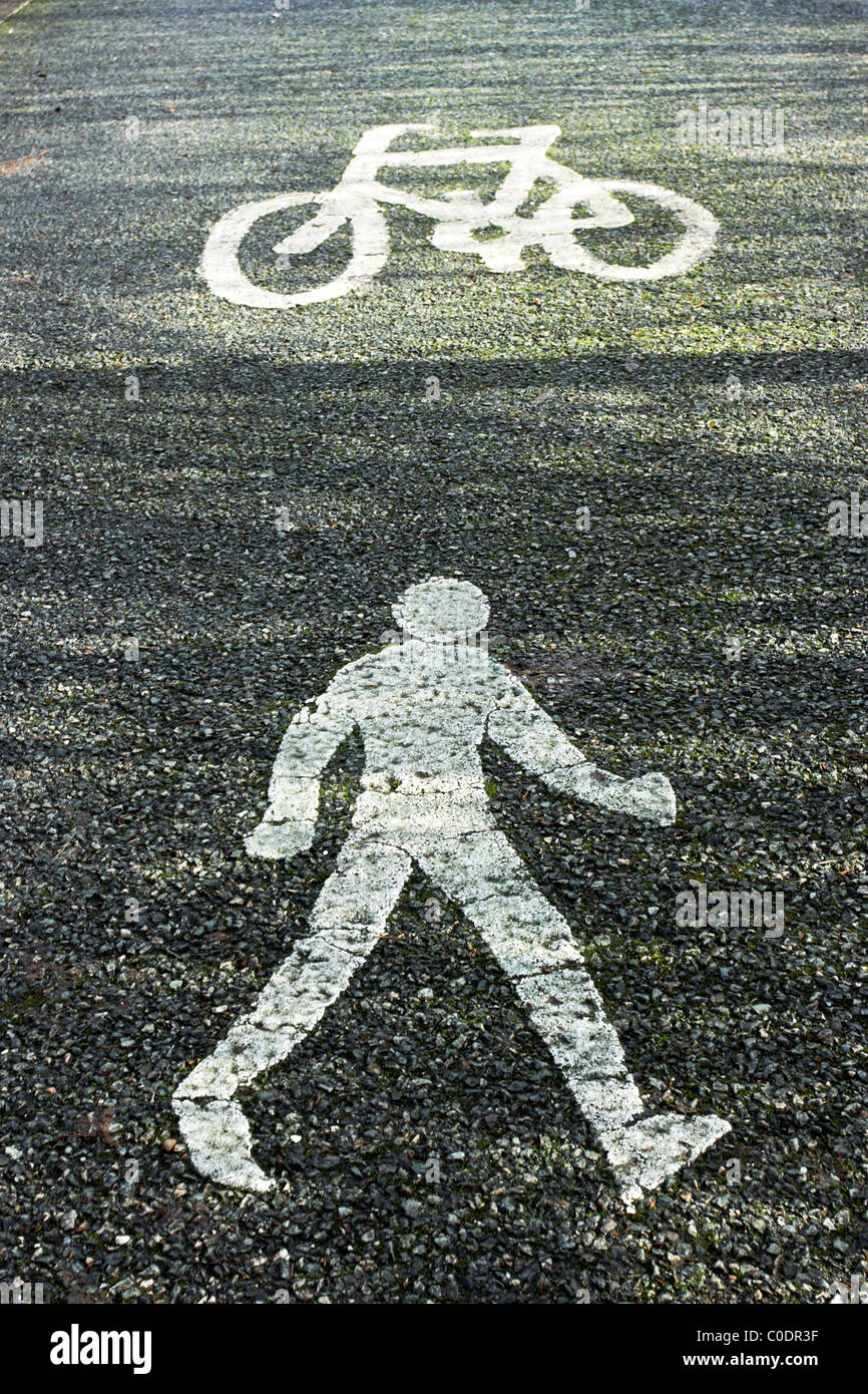 A footpath and cycle track sign painted on tarmac Stock Photo - Alamy