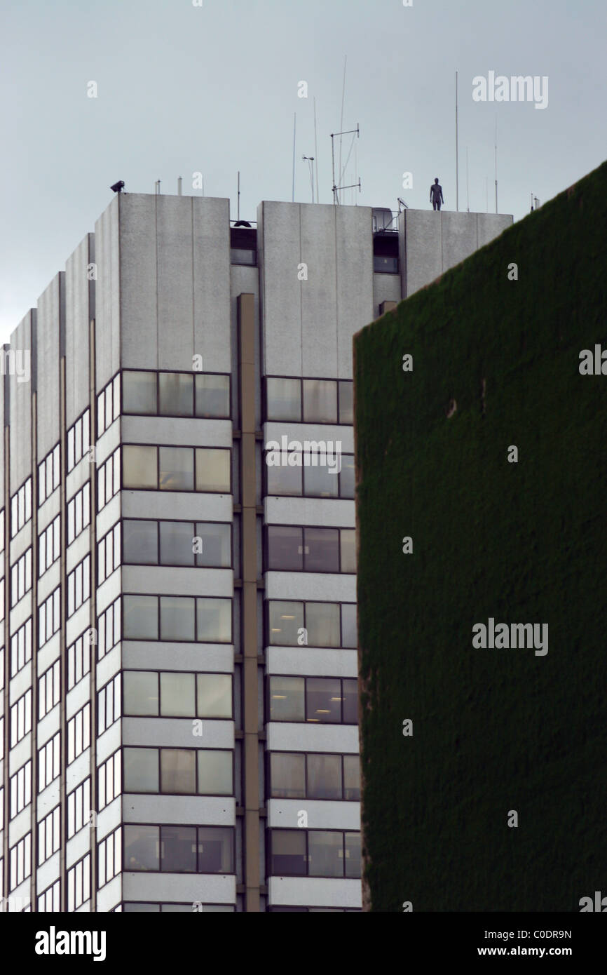 Antony Gormley sculpture on the rooftop of the ITV building. Part of ...