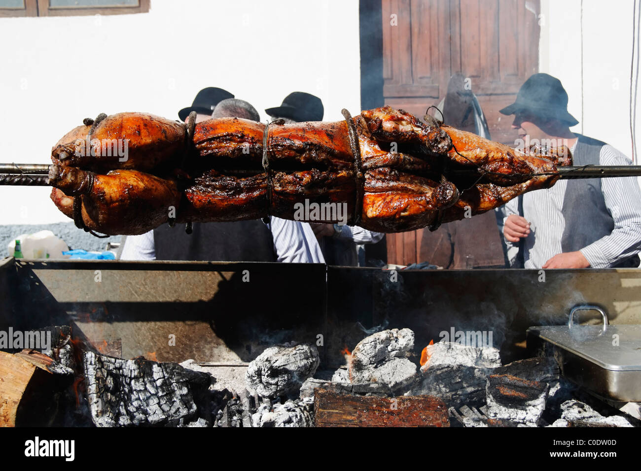 Whole pig roasting on barbecue at Fiesta del Almendro in Tejeda, Gran ...