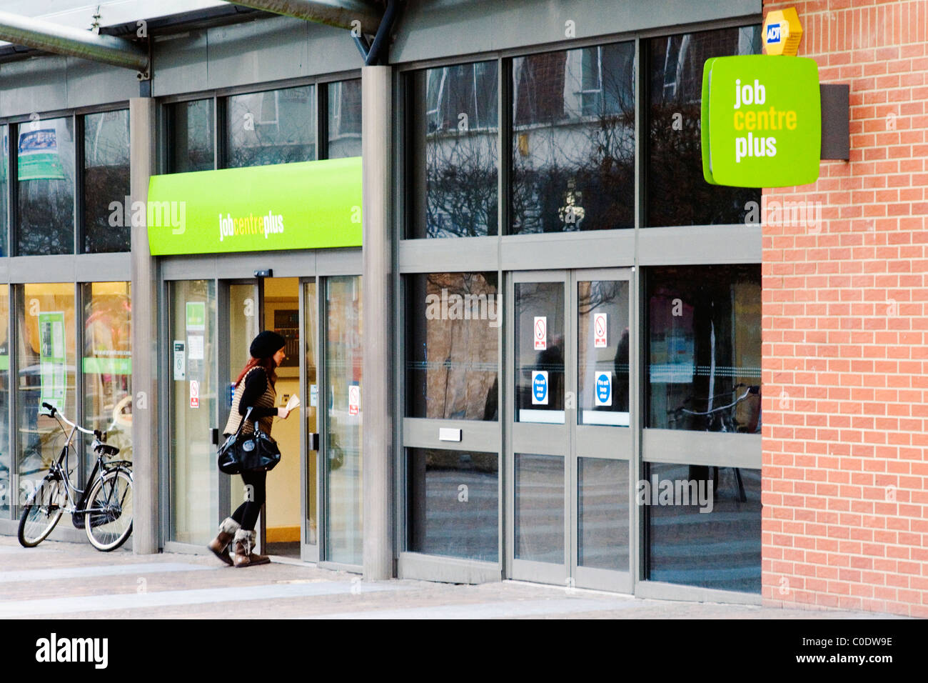 young woman entering a job centre plus Stock Photo - Alamy