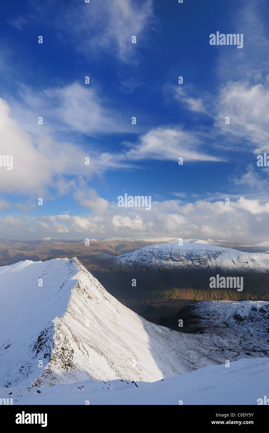 Deep blue skies above snow covered Striding Edge in winter in the ...
