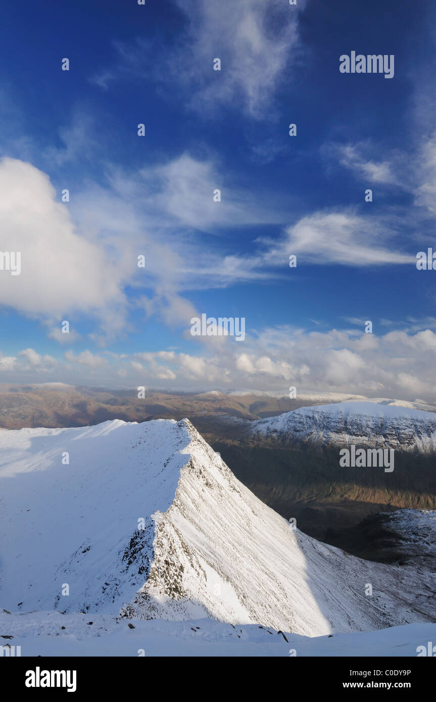 Deep blue skies above snow covered Striding Edge in winter in the ...