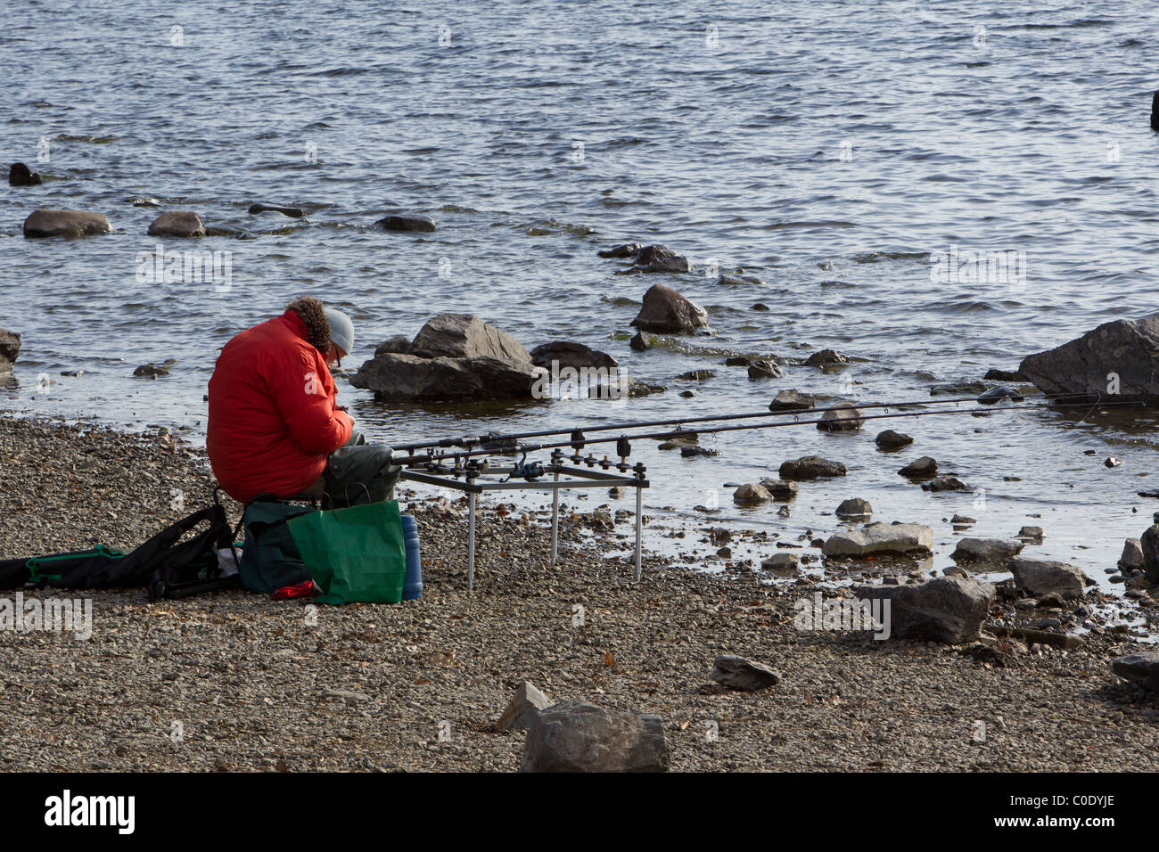 Fisherman casting with rod & line on Lake Windermere a beautiful ...