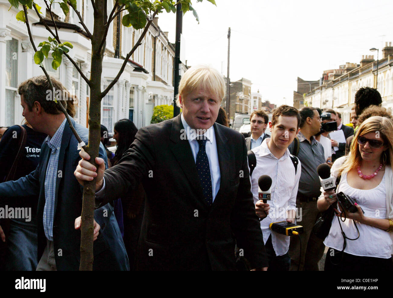 Mayor of London, Boris Johnson visits Brixton to Plant a pear tree in ...
