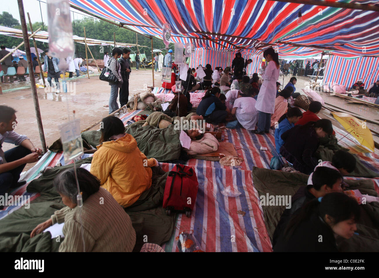 Earthquake victims receive medical treatment in a makeshift hospital ...