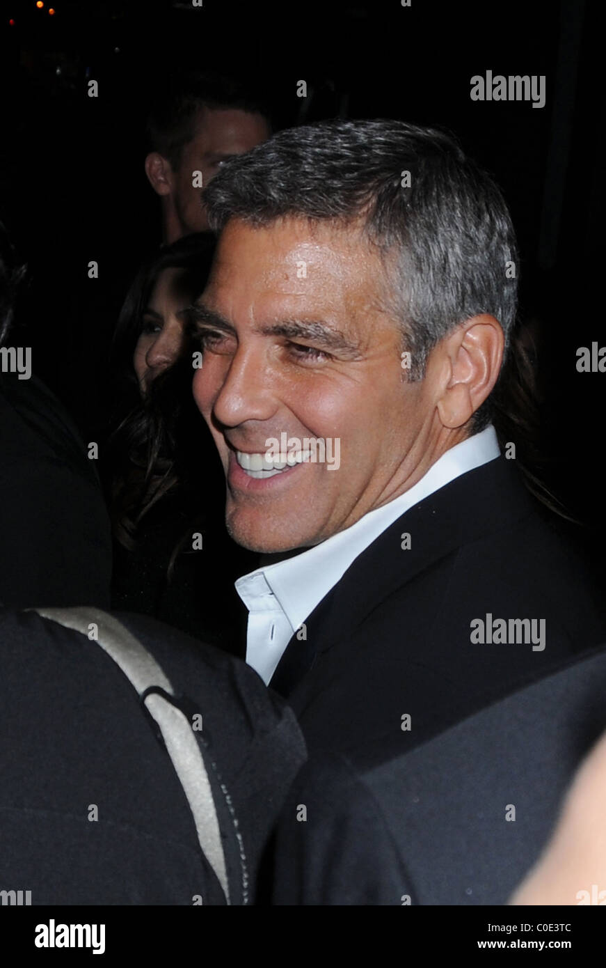 George Clooney signs for fans after leaving his birthday party at ...