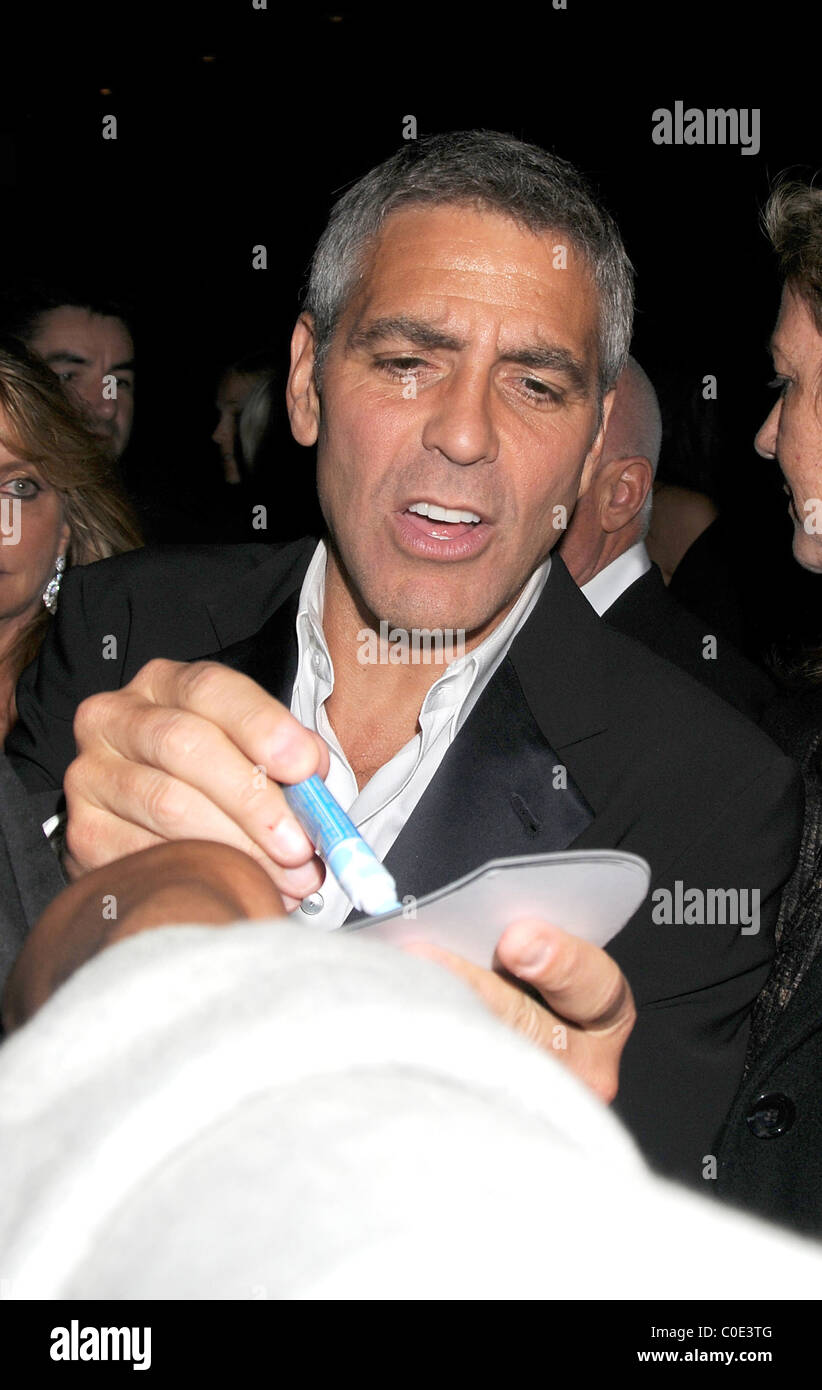George Clooney signs for fans after leaving his birthday party at ...