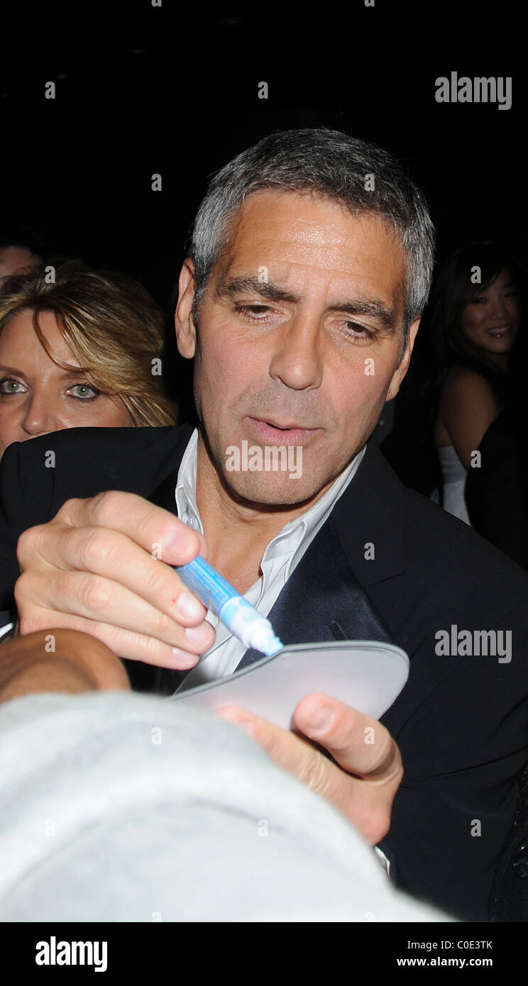 George Clooney signs for fans after leaving his birthday party at ...