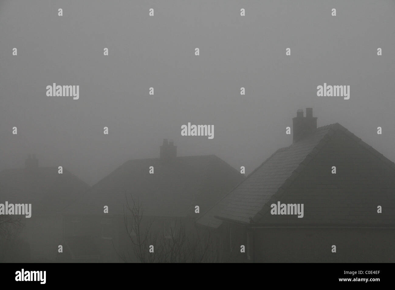 houses roof tops in thick fog Stock Photo - Alamy