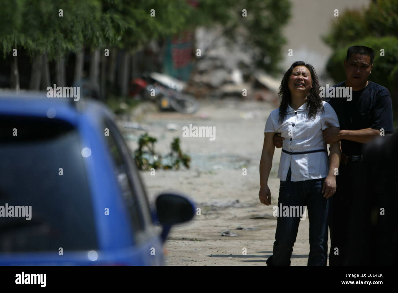 A woman survivor cries as she leaves Beichuan county Soldiers of the ...