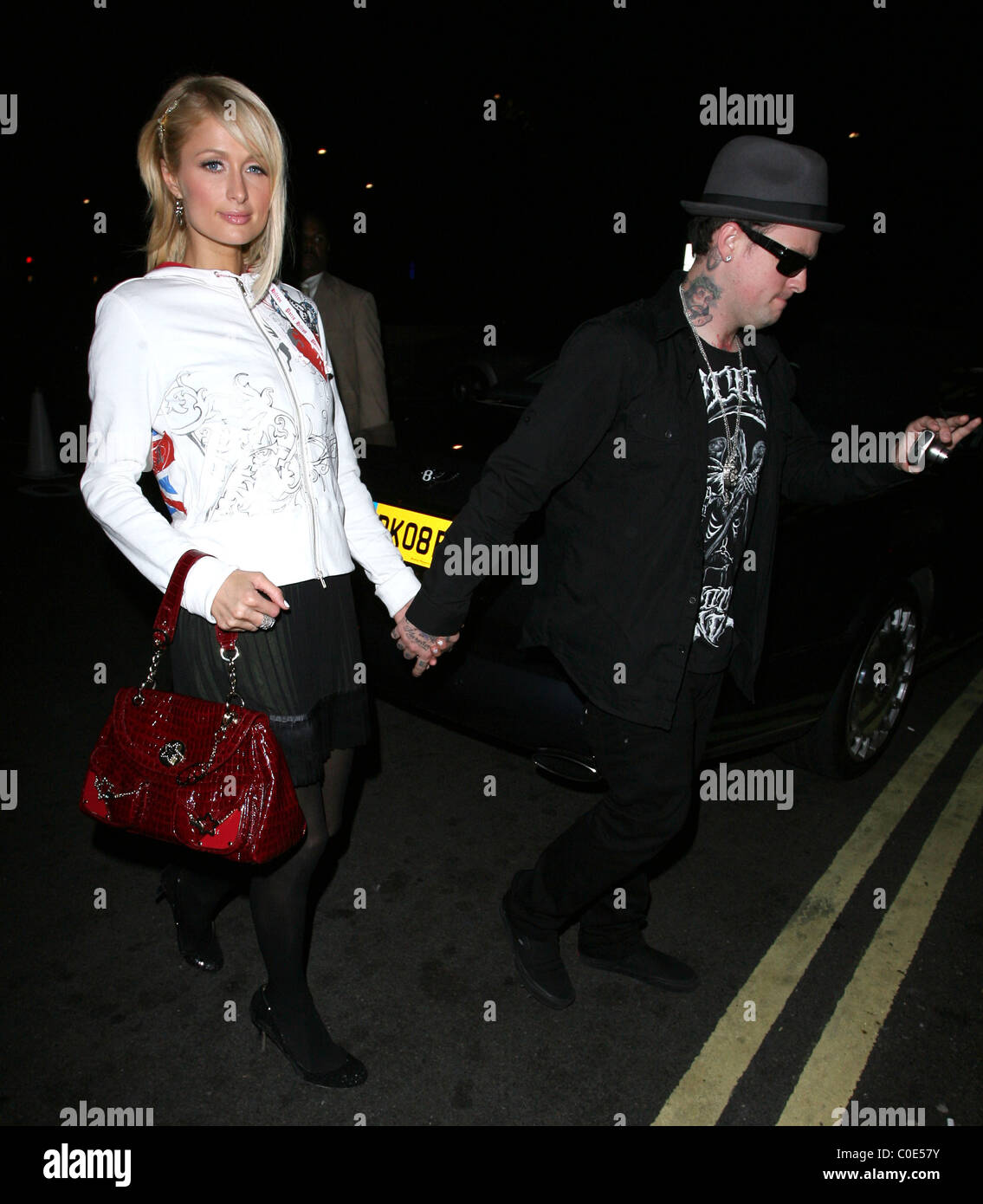 Paris Hilton and her boyfriend Benji Madden arrive back at the ...