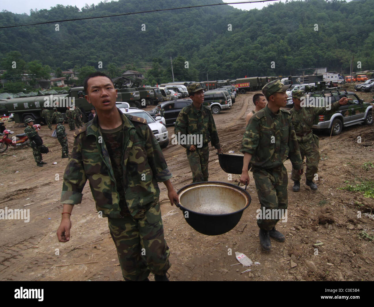 PLA soldiers cook for injured people in Beichuan, Official estimates of ...