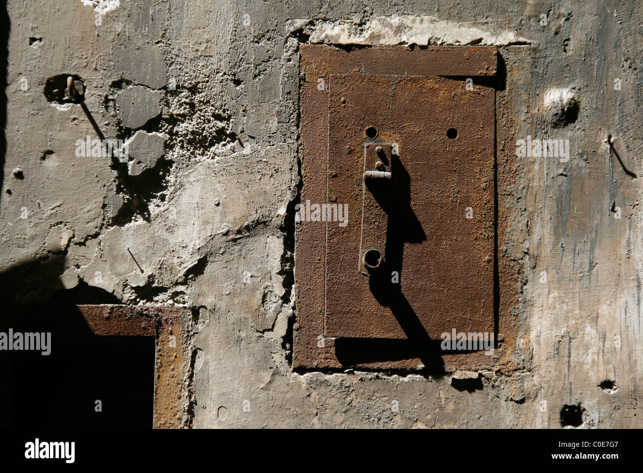 old rusty steel door hatch on wall on derelict property Stock Photo - Alamy