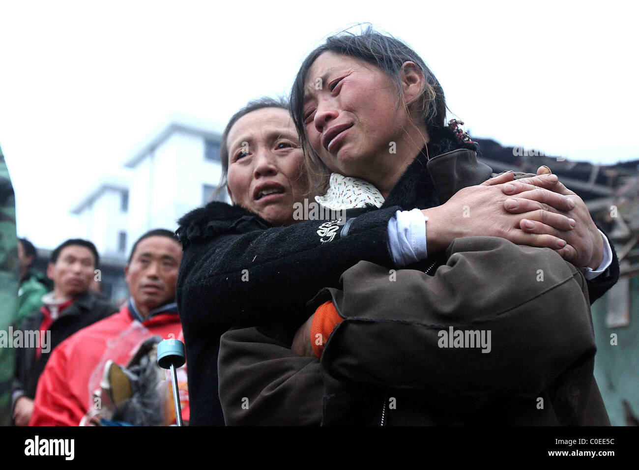 Parents cry as they wait to hear information of their missing children ...