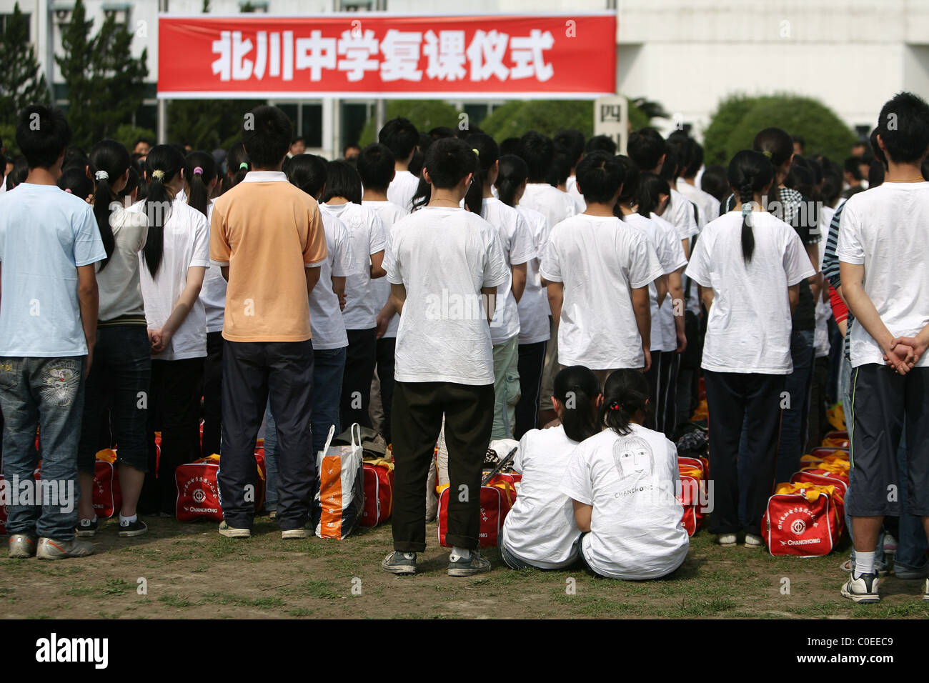Students attend a ceremony at the reopened Beichuan high school which ...