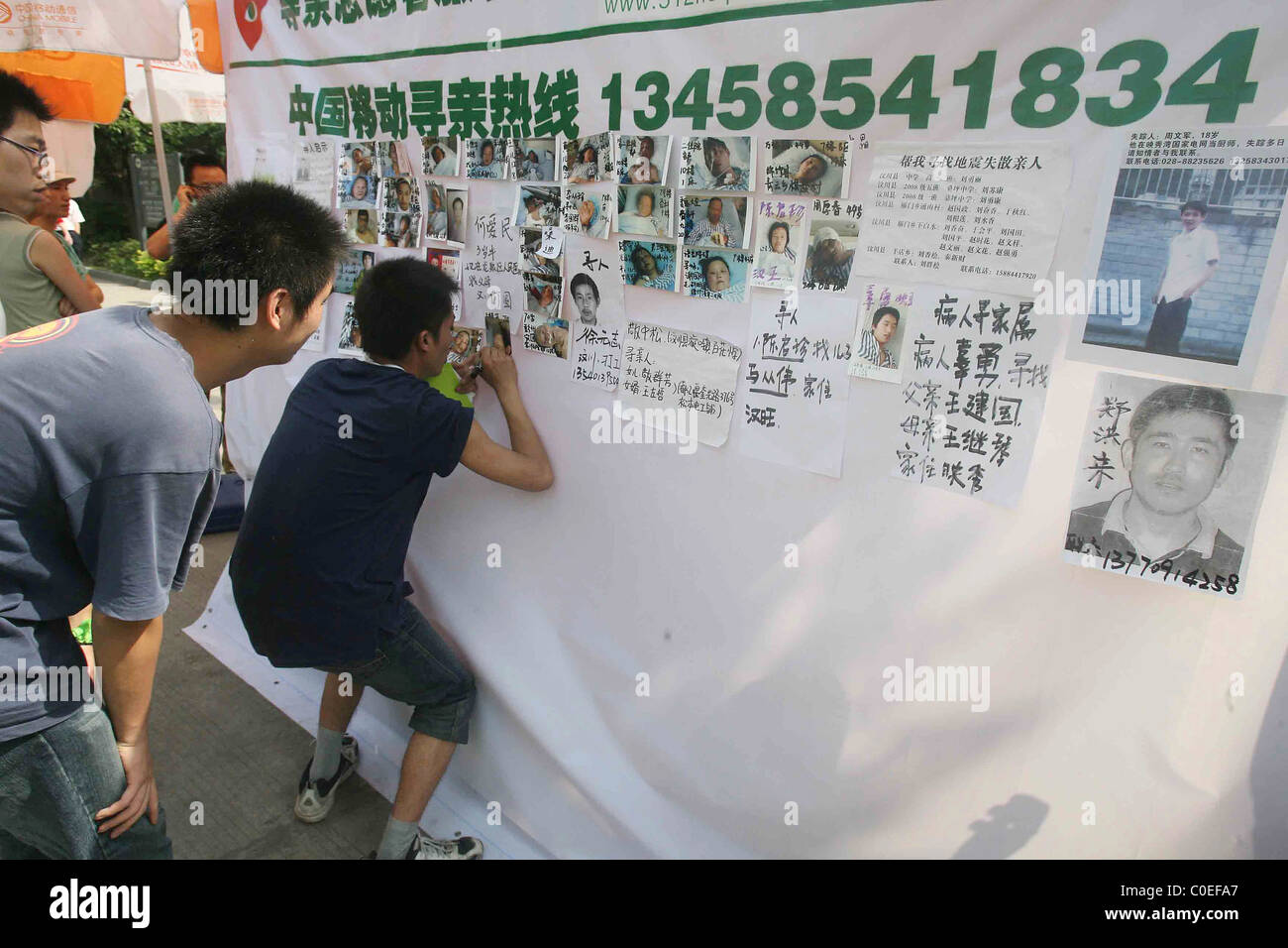 People look for the names of missing family members in West China ...