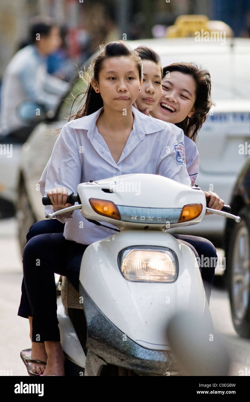 People riding scooters/mopeds in Vietnam in Hanoi Stock Photo - Alamy