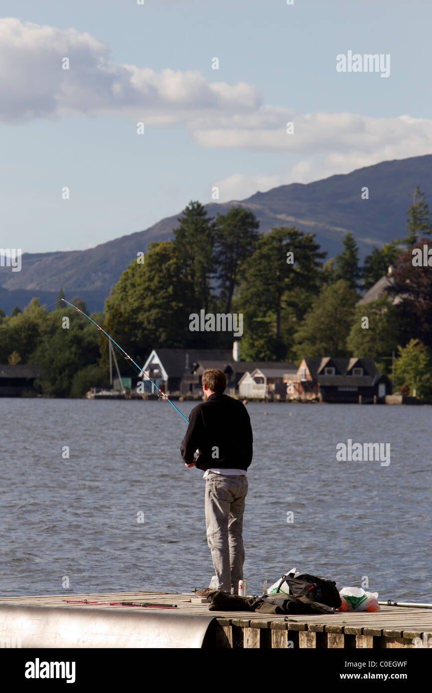 Fisherman casting with rod & line on Lake Windermere a beautiful ...