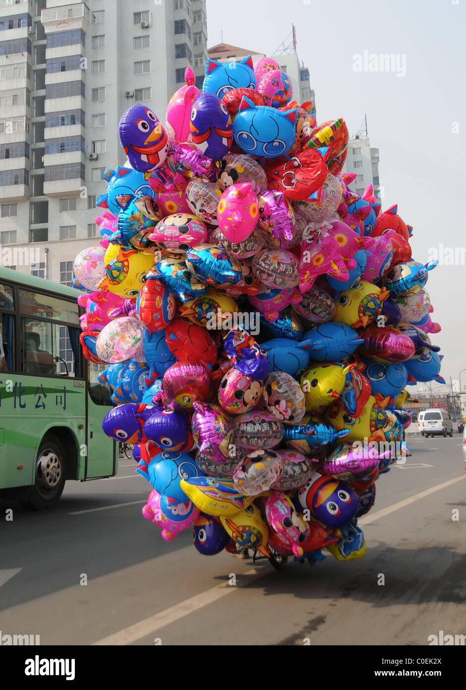 BALLOON RIDE A balloon salesman in China wowed onlookers by loading his ...