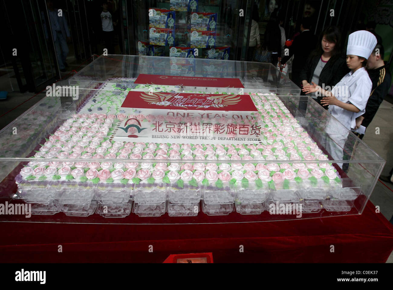 CAKE FILLS DEPARTMENT STORE A gigantic birthday cake displayed on the ...