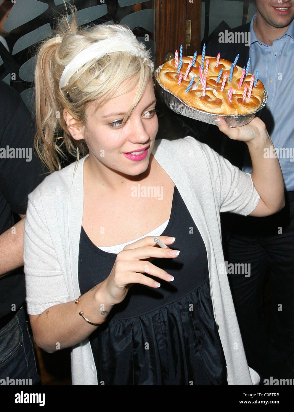 Lily Allen is given a birthday cake by the paparazzi outside the ...
