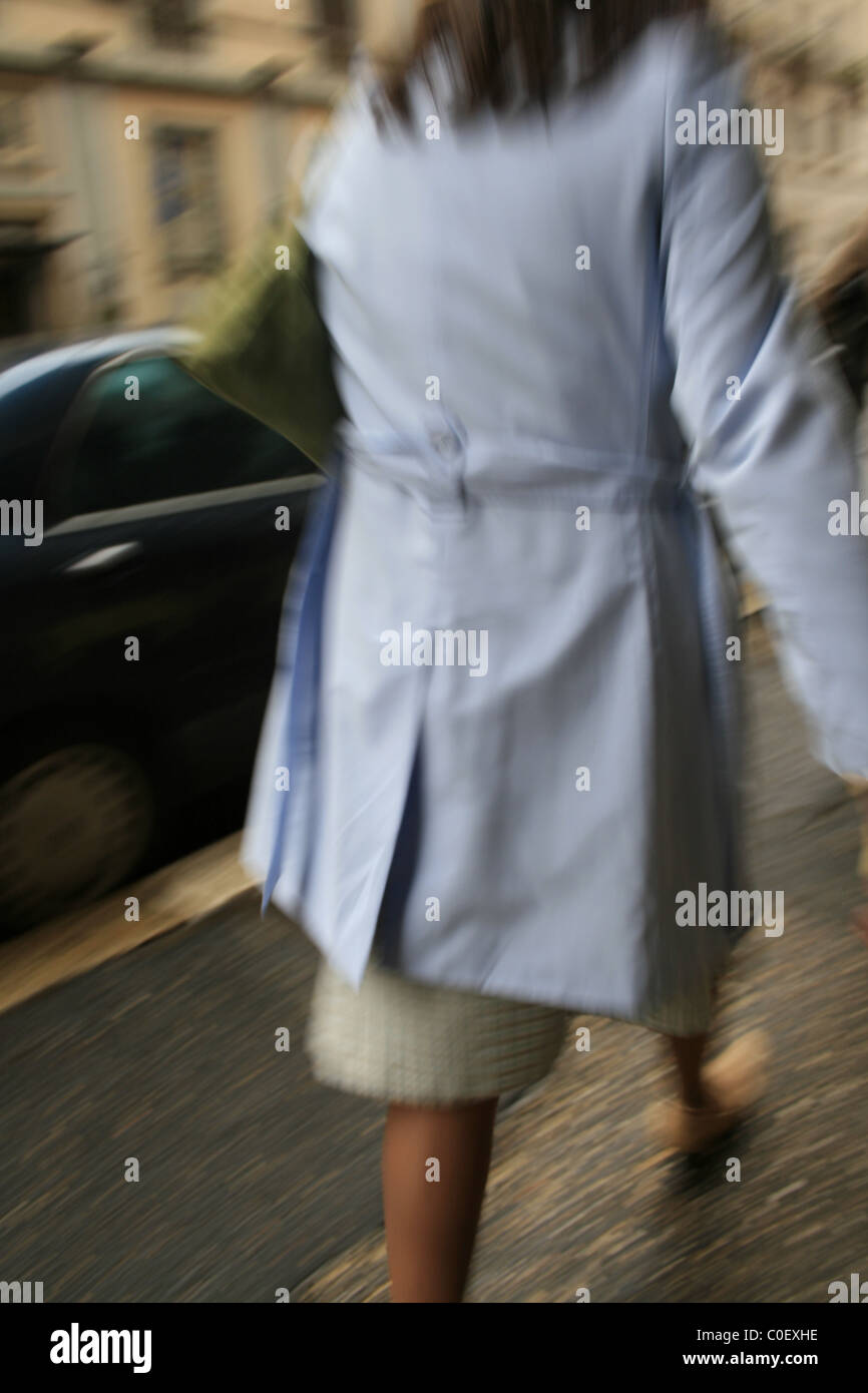woman commuter shopper feet legs walking in street in town Stock Photo ...
