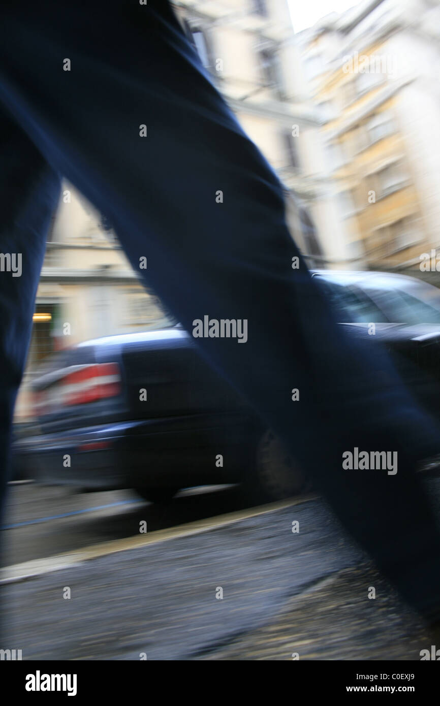 person walking in heavy rain in city town Stock Photo - Alamy