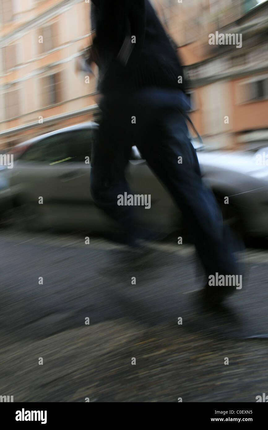 person walking in heavy rain in city town Stock Photo - Alamy