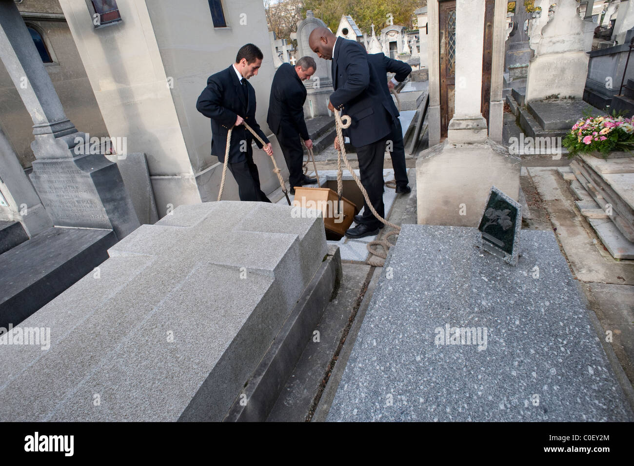 Lowering coffin hi-res stock photography and images - Alamy