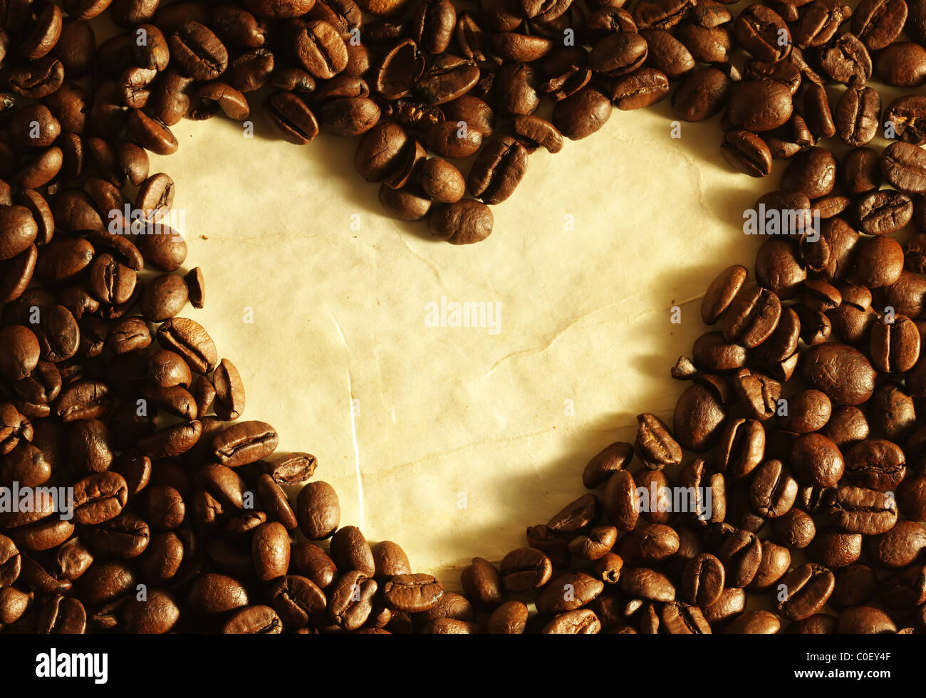 Heart shape in coffee beans Stock Photo - Alamy