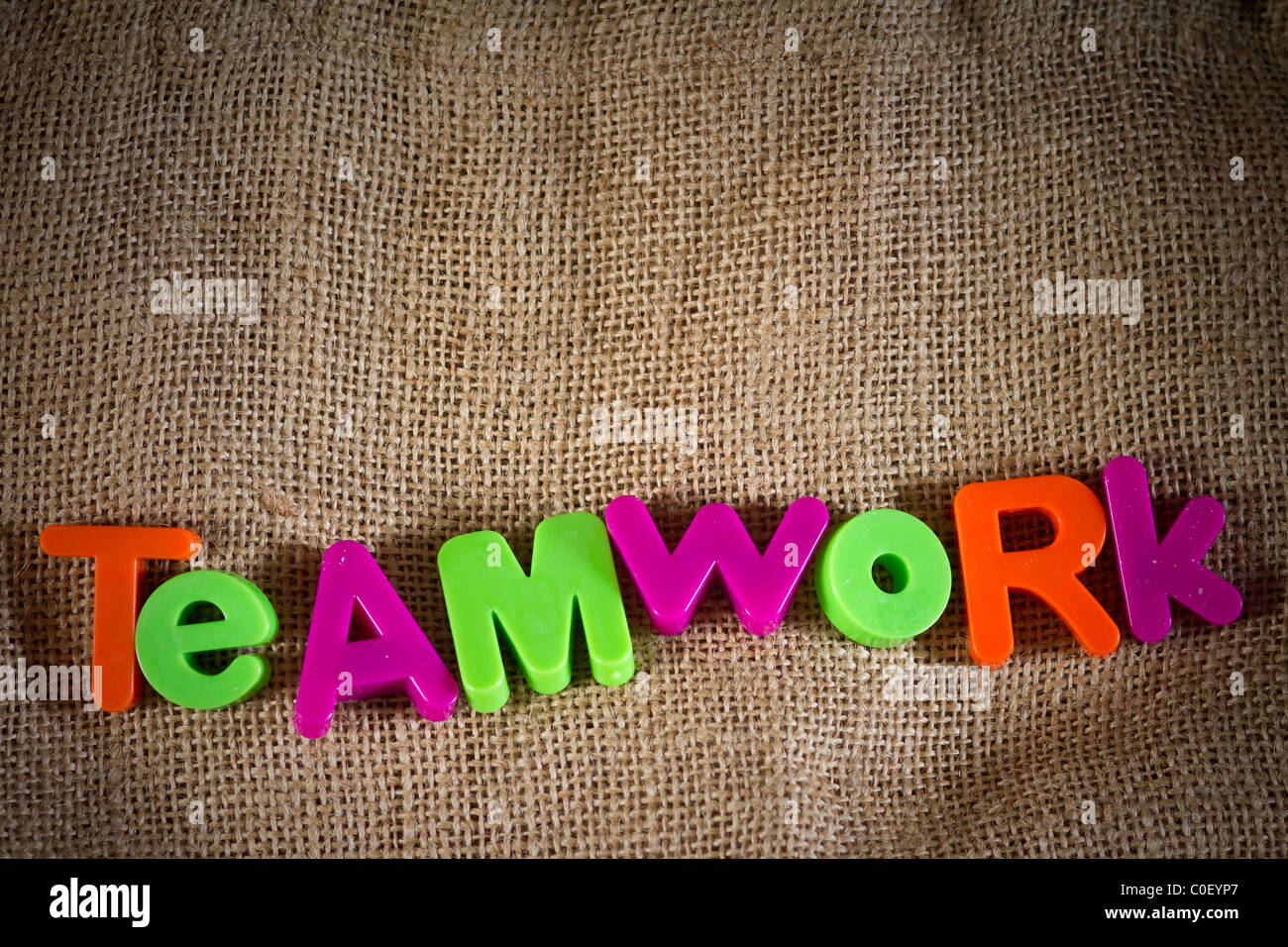 Teamwork Dictionary Definition Low key close up Stock Photo - Alamy