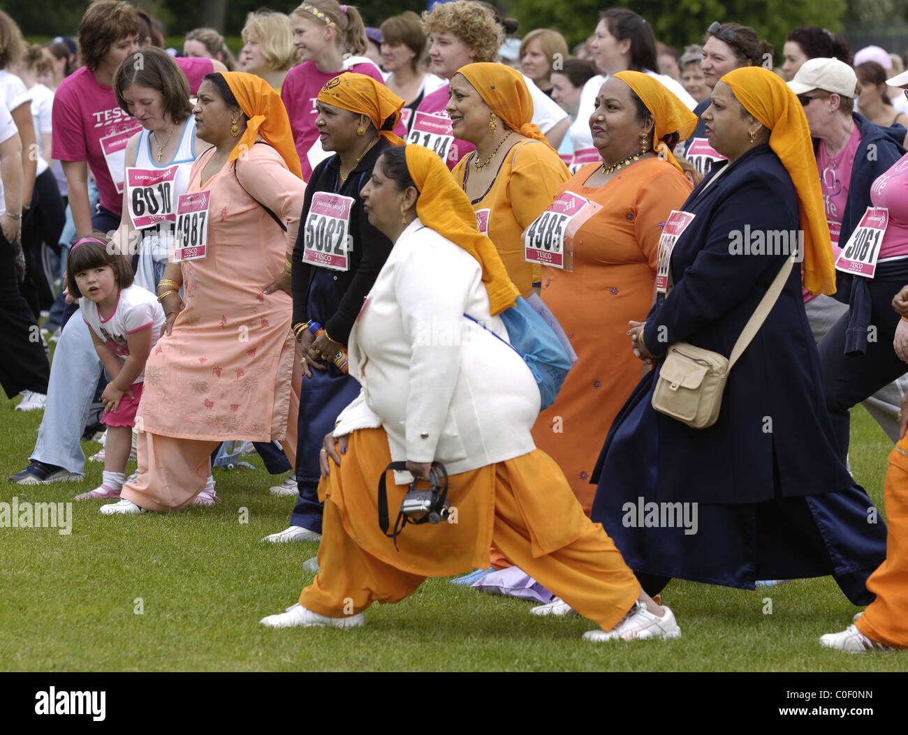 group of people stretching getting ready for fun run Stock Photo - Alamy