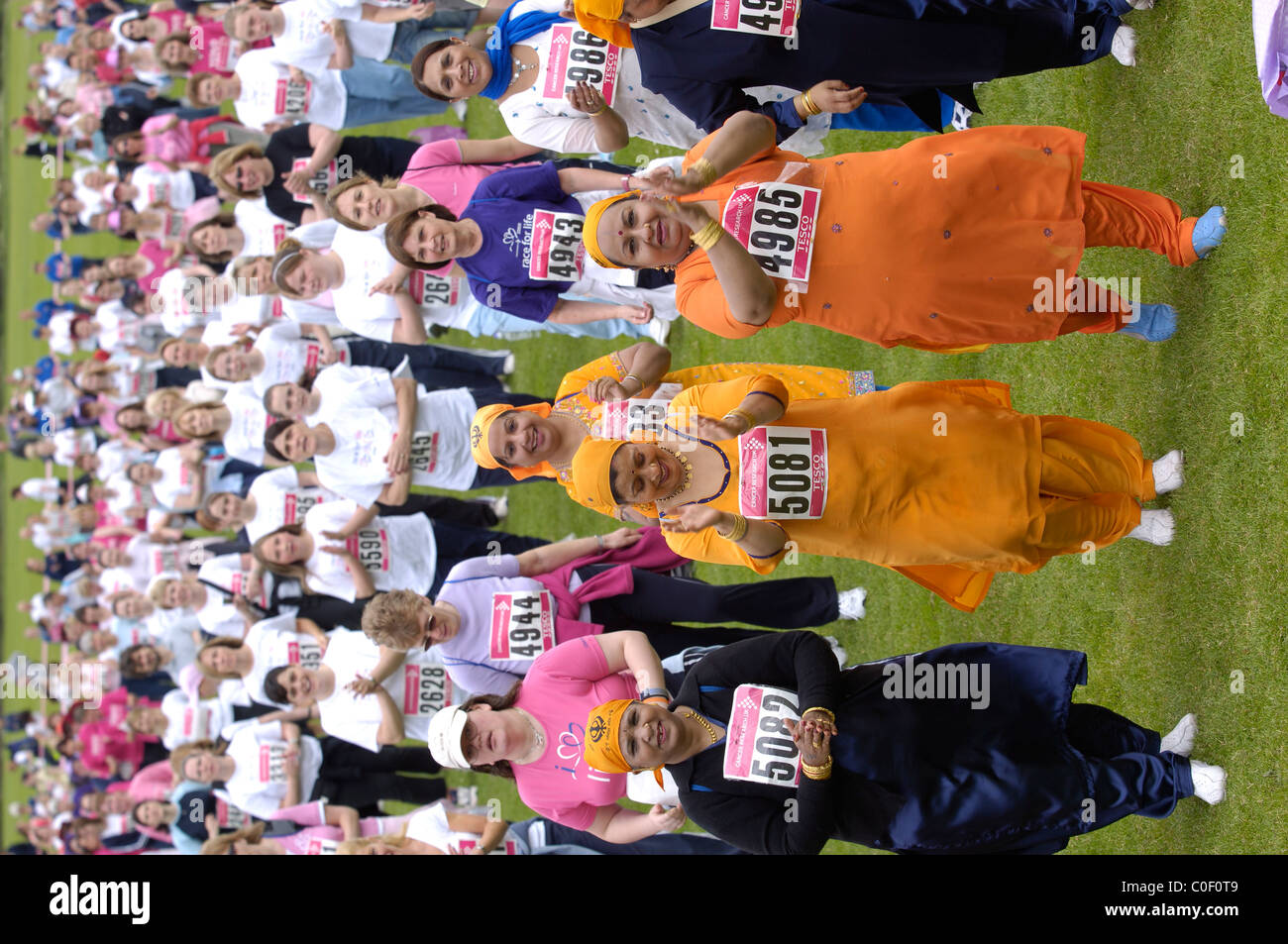 group of people stretching getting ready for fun run Stock Photo - Alamy