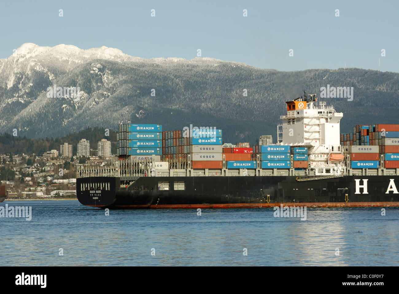 Stern of a Container freighter in the inner harbour of Vancouver, with ...